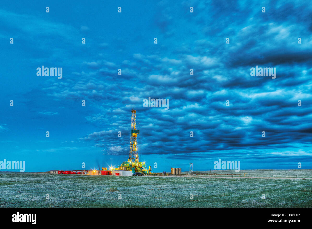 Hydraulic fracturing natural gas drilling rig at dusk, in the eastern ...