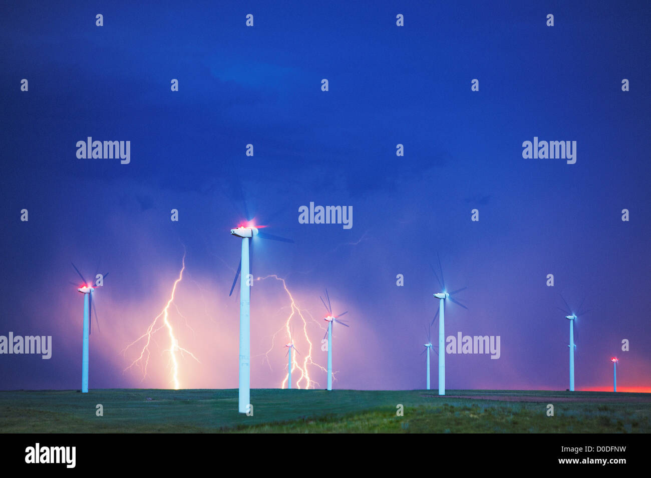 Severe thunderstorm unleashes lightning throughout a wind farm Stock ...