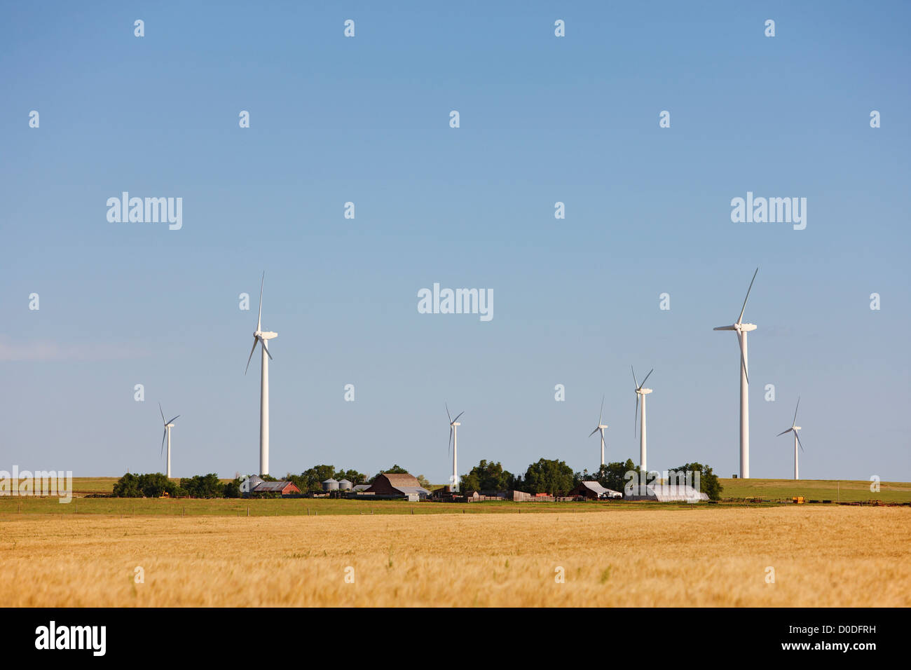 Ranch with a backdrop of a line of wind turbines Stock Photo - Alamy