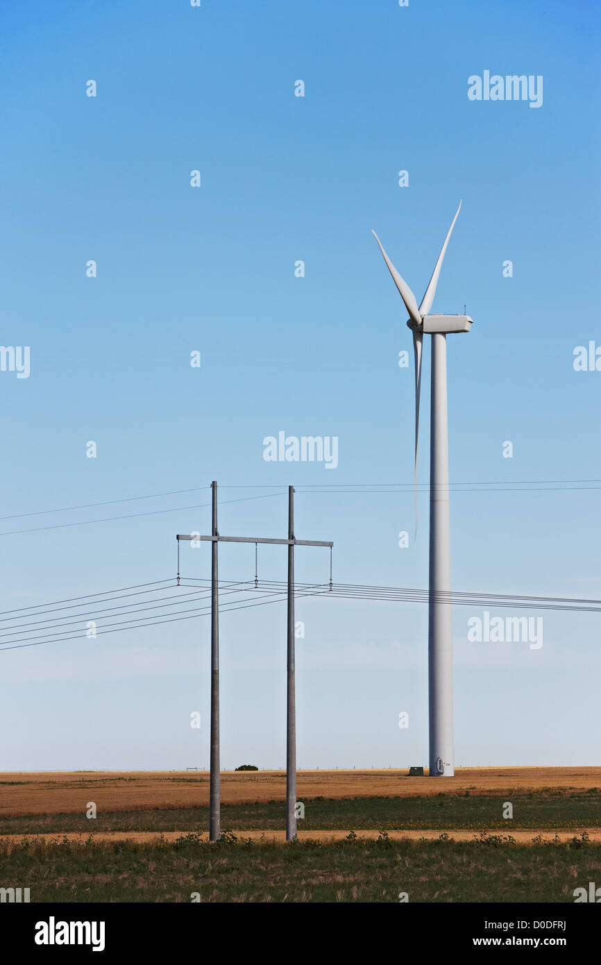 A wind turbine and high voltage power lines Stock Photo - Alamy