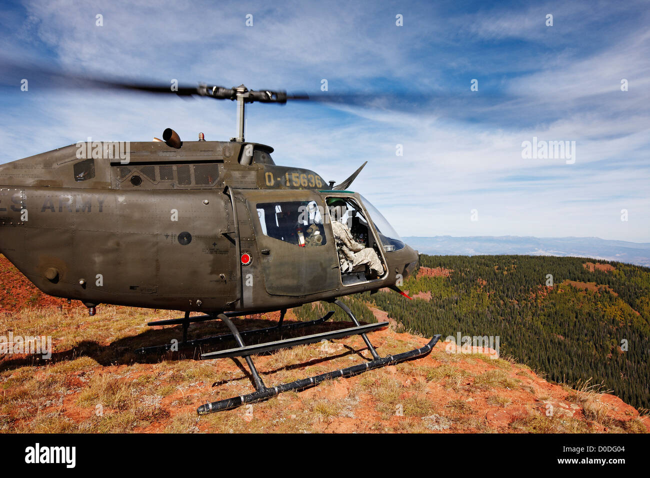An OH-58 Kiowa, of the Colorado Army National Guard, idles at the edge ...