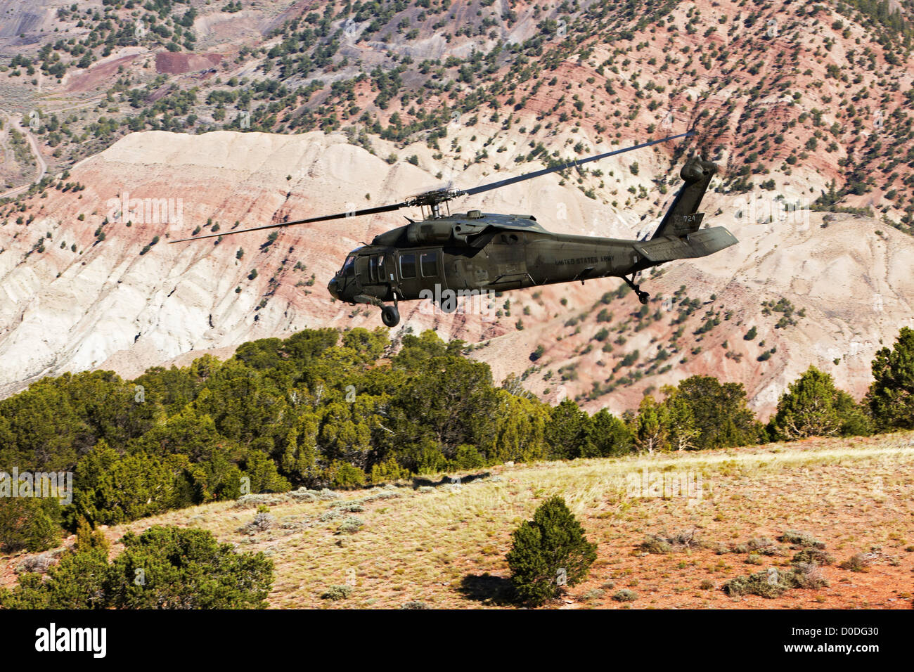 A UH-60 Blackhawk helicopter launches from a high altitude landing zone ...