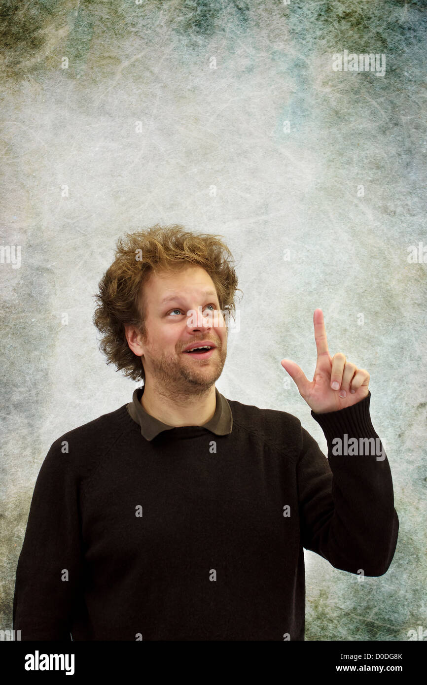 Man looking and pointing upwards Stock Photo - Alamy