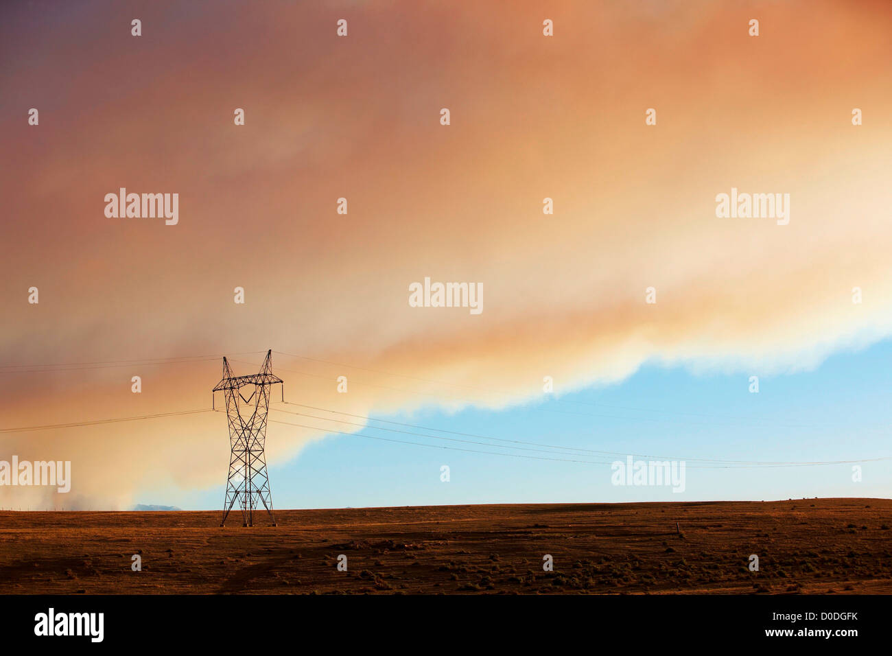 High voltage power line, smoke from raging mountain wildfire, Colorado ...