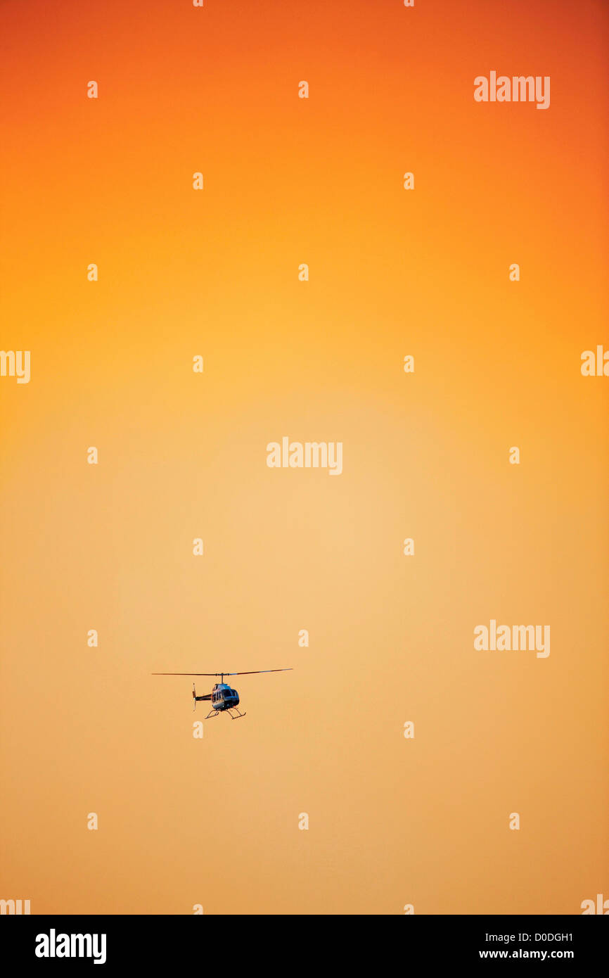 Helicopter flies through dense smoke from raging mountain wildfire ...