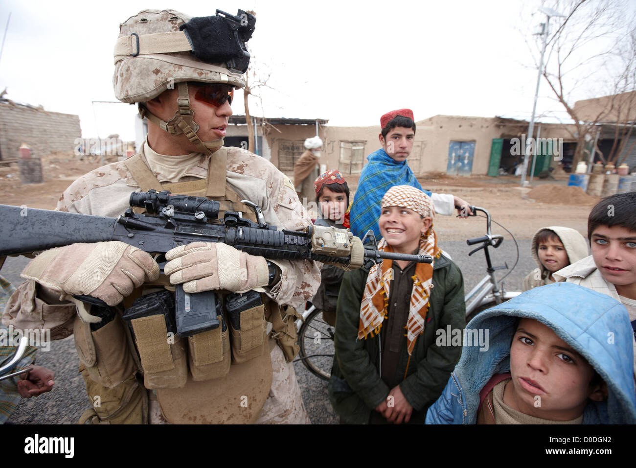 A United States Marine surrounded Afghan children during combat ...