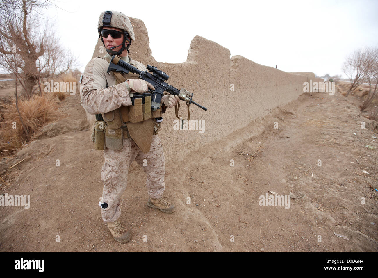 A United States Marine, holding an M4 Carbine, during a combat ...