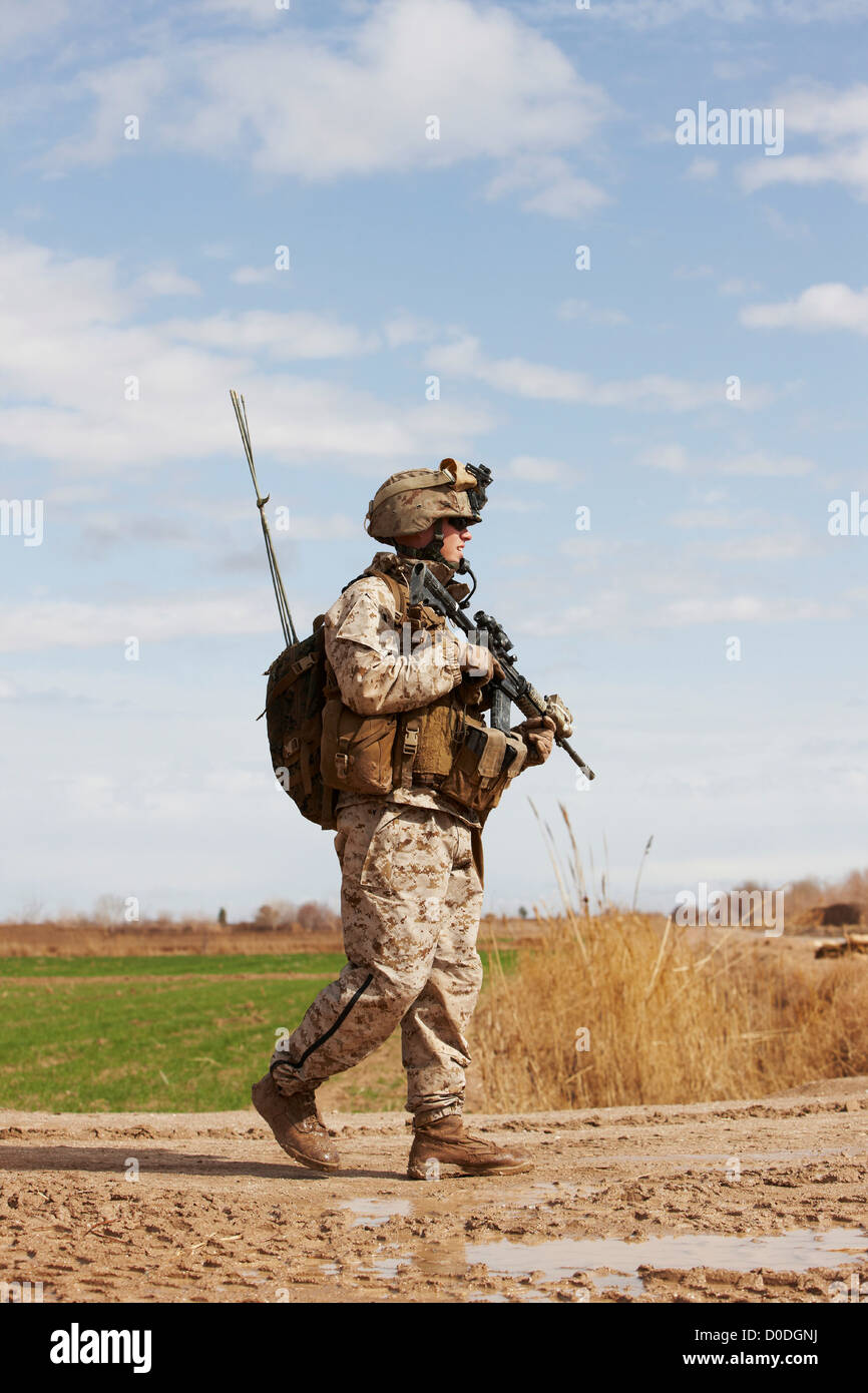 United States Marine on a combat patrol near the city of Marjah, in the ...