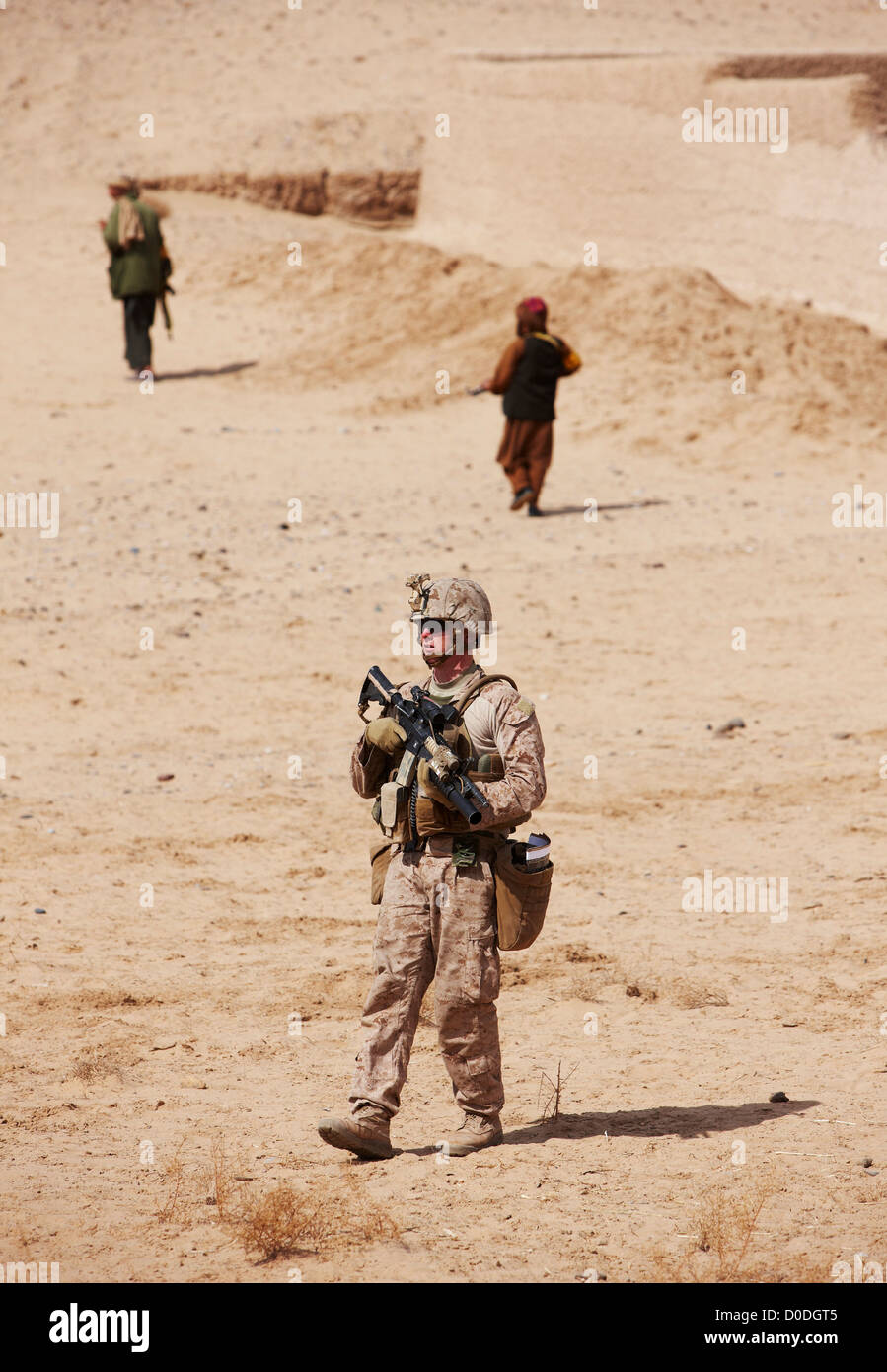 United States Marine on a combat patrol near the city of Marjah, in the ...