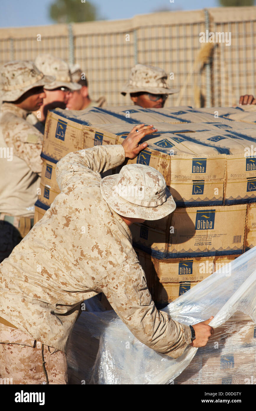 United States Marines unload boxes bottled water remote austere forward ...
