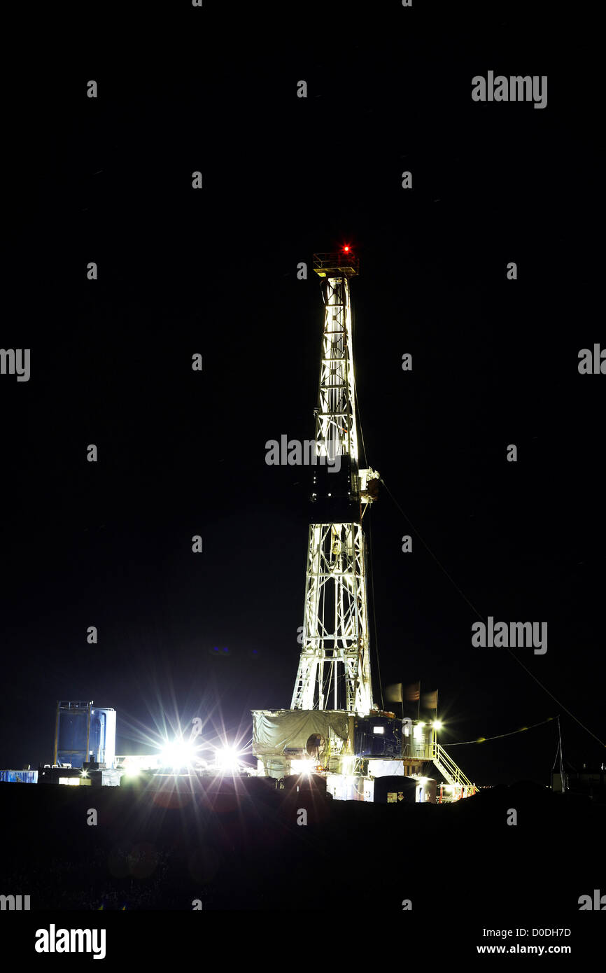 Night view of a natural gas drilling rig, Colorado Stock Photo - Alamy