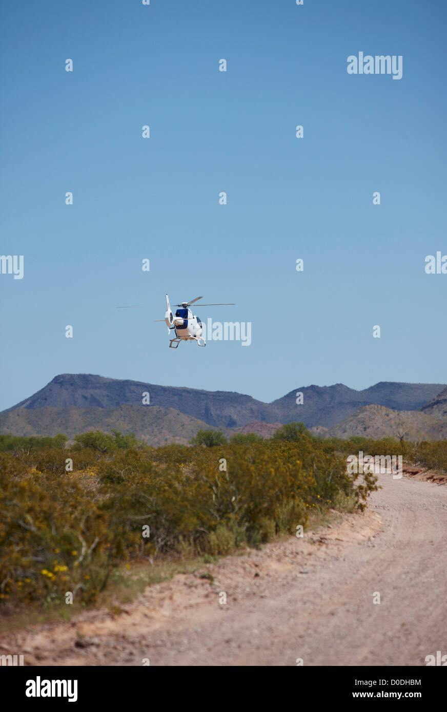 Border patrol helicopter flying low over the United States - Mexico ...