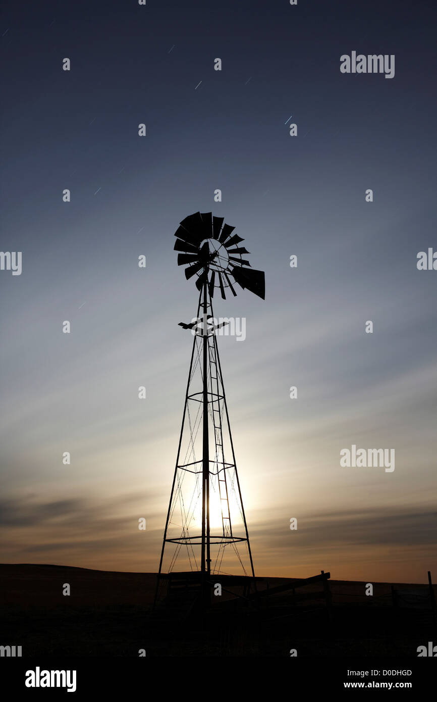 Windmill on plains at night, backlit by moon Stock Photo - Alamy