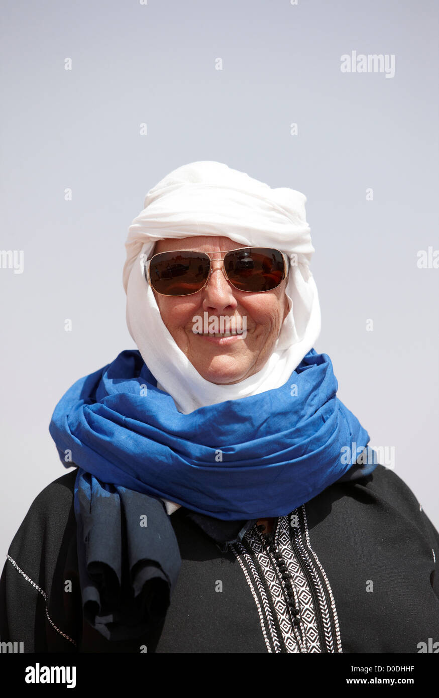 Female French tourist wearing a Saharan Gandora, a turban, and a ...
