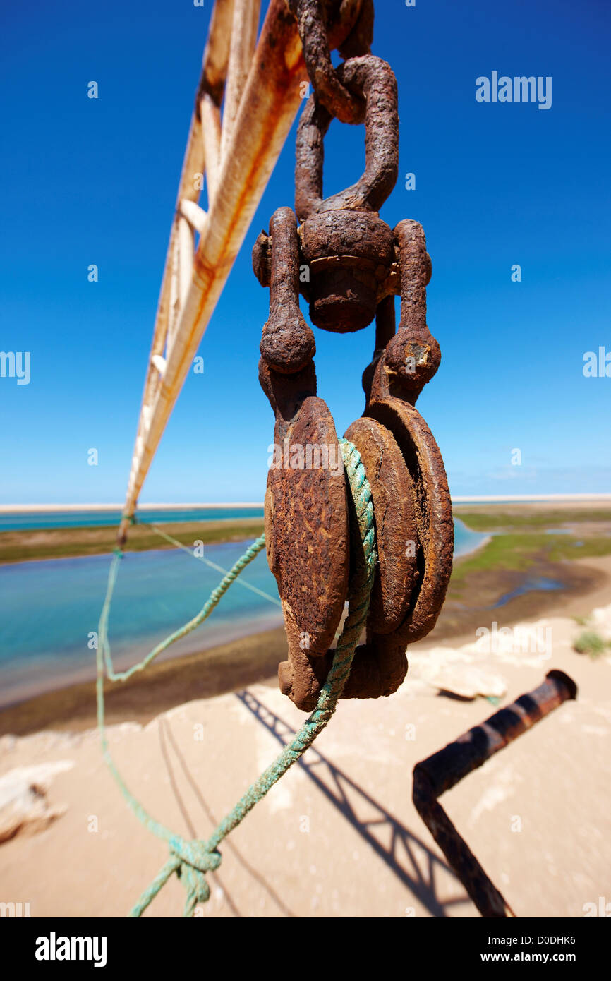 Pulley and boom for unloading items from a boat at a dock in southern ...