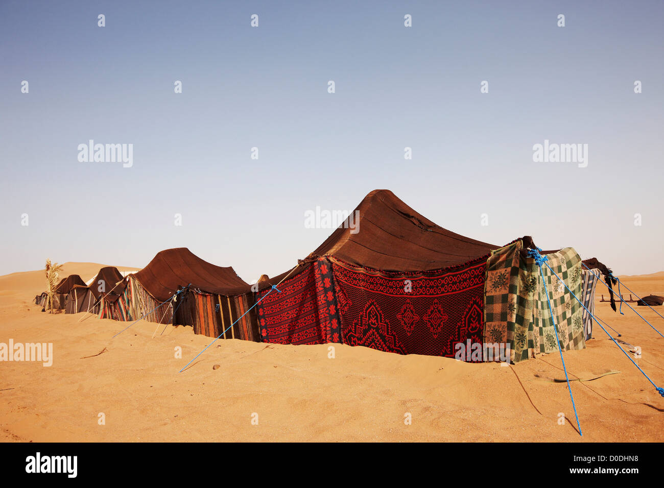 Bedouin Nomad tents in sand dunes, Erg Chegaga, interior Sahara Desert ...