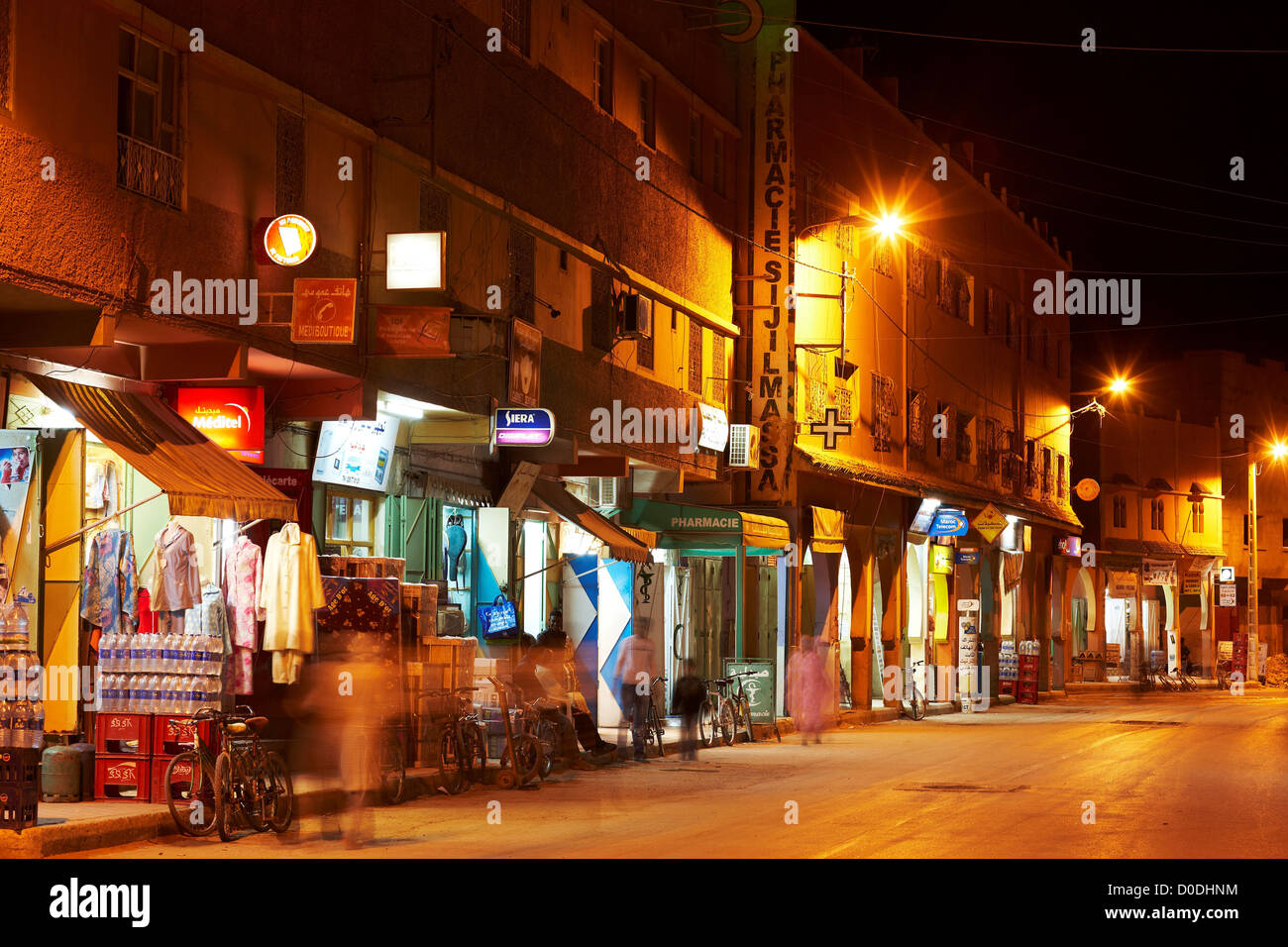 Night view of city street and shops, Sahara Desert outpost, Morocco ...