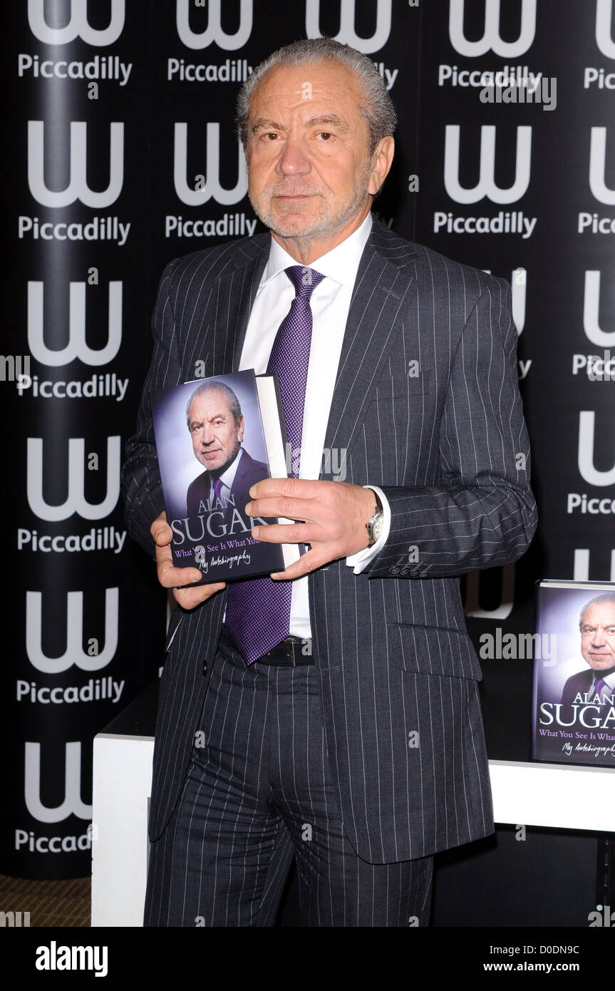 Sir Alan Sugar signs copies of his new autobiography ' You see what you ...