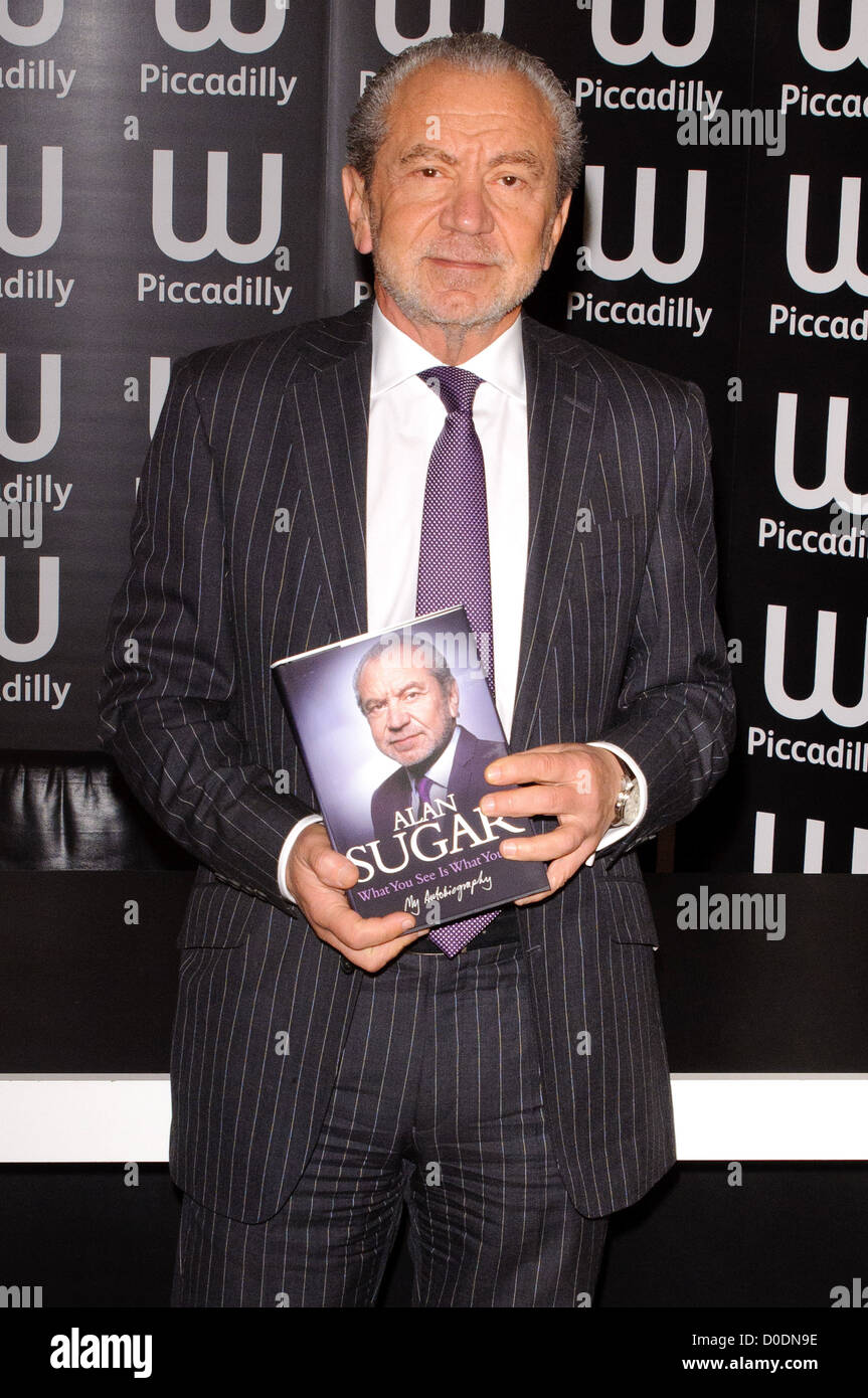 Sir Alan Sugar signs copies of his new autobiography ' You see what you ...