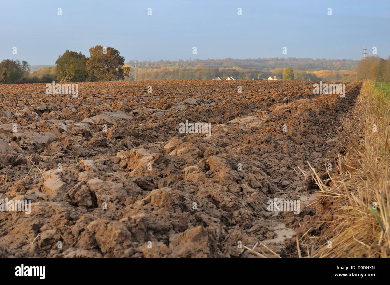 field of freshly turned topsoil forming large clods of earth Stock ...