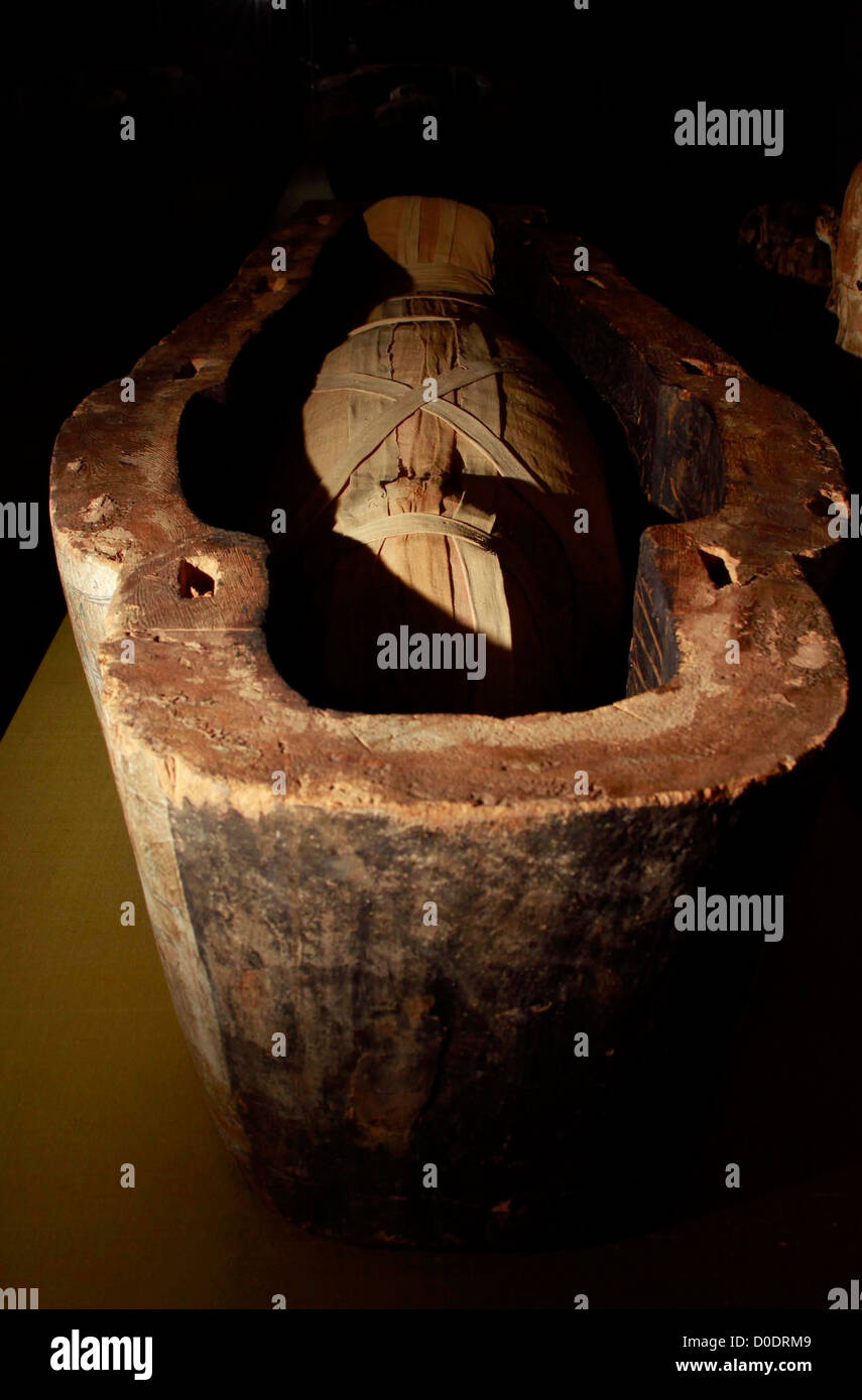 An ancient Egyptian coffin and mummy are installed in advance of the ...