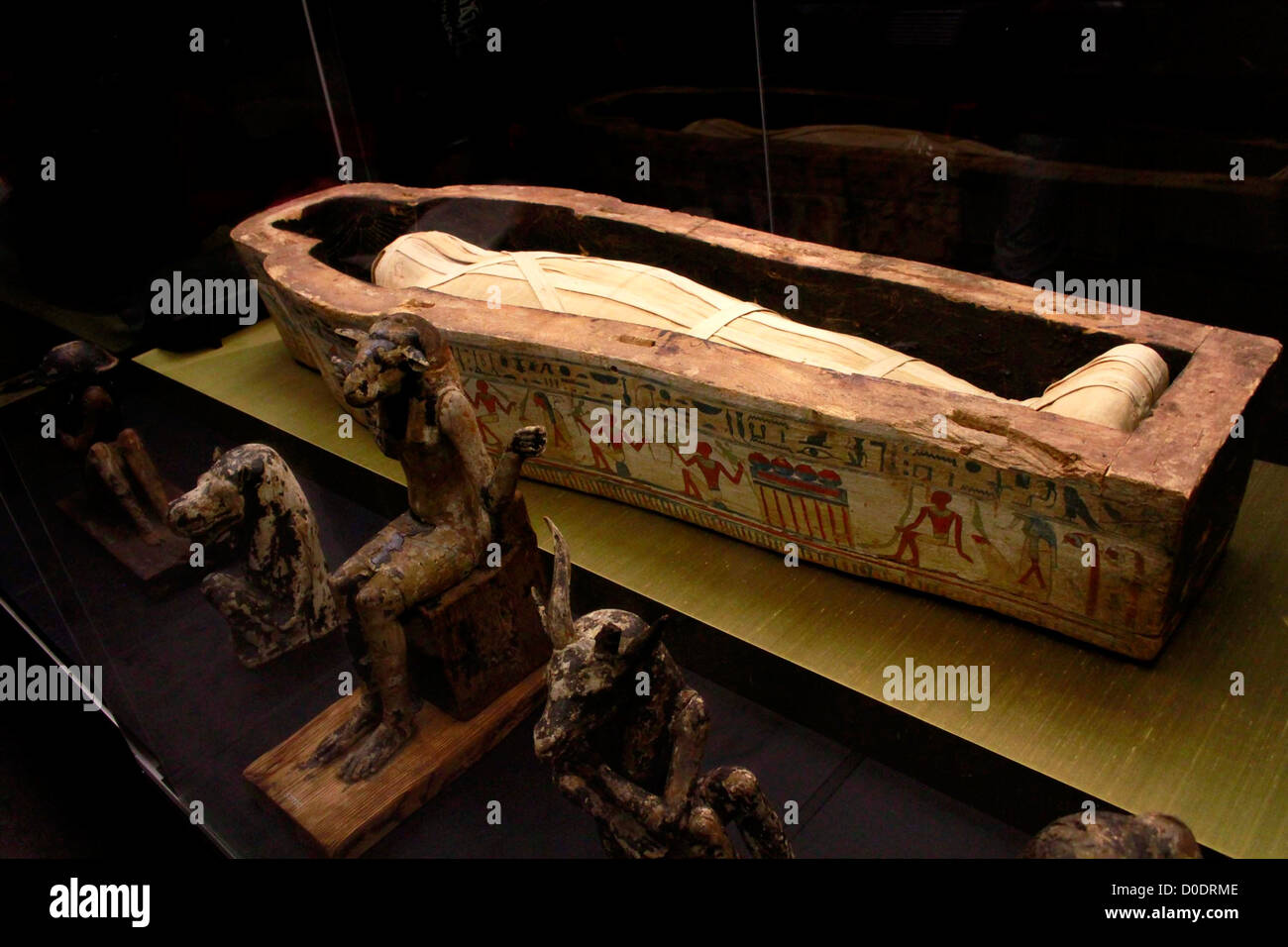 An ancient Egyptian coffin and mummy are installed in advance of the ...