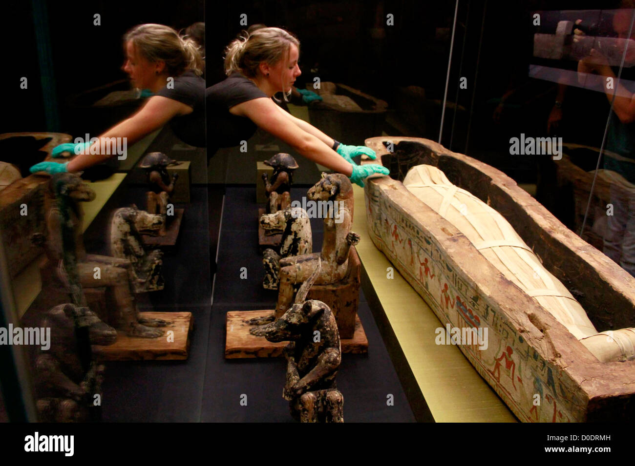An ancient Egyptian coffin and mummy are installed in advance of the ...