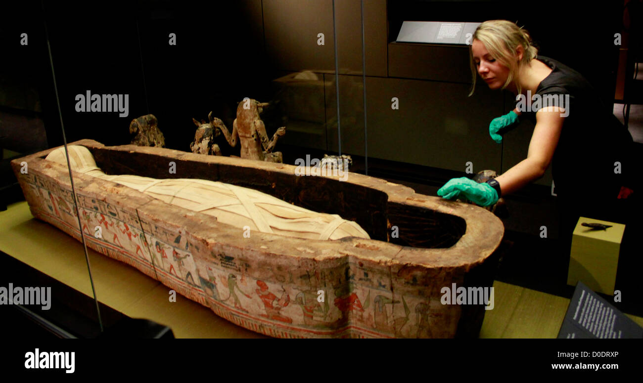 An ancient Egyptian coffin and mummy are installed in advance of the ...