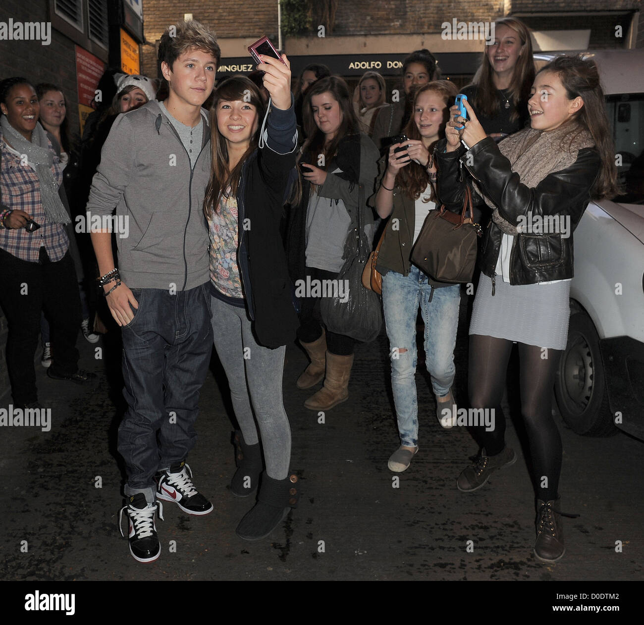 X Factor finalist Niall Horan from boy band One Direction is mobbed by ...