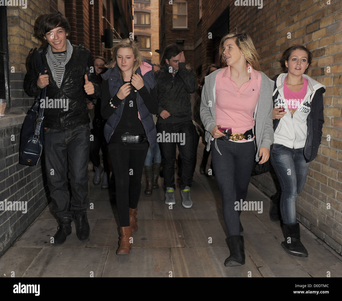 X Factor finalist Louis Tomlinson from boy band One Direction is mobbed ...