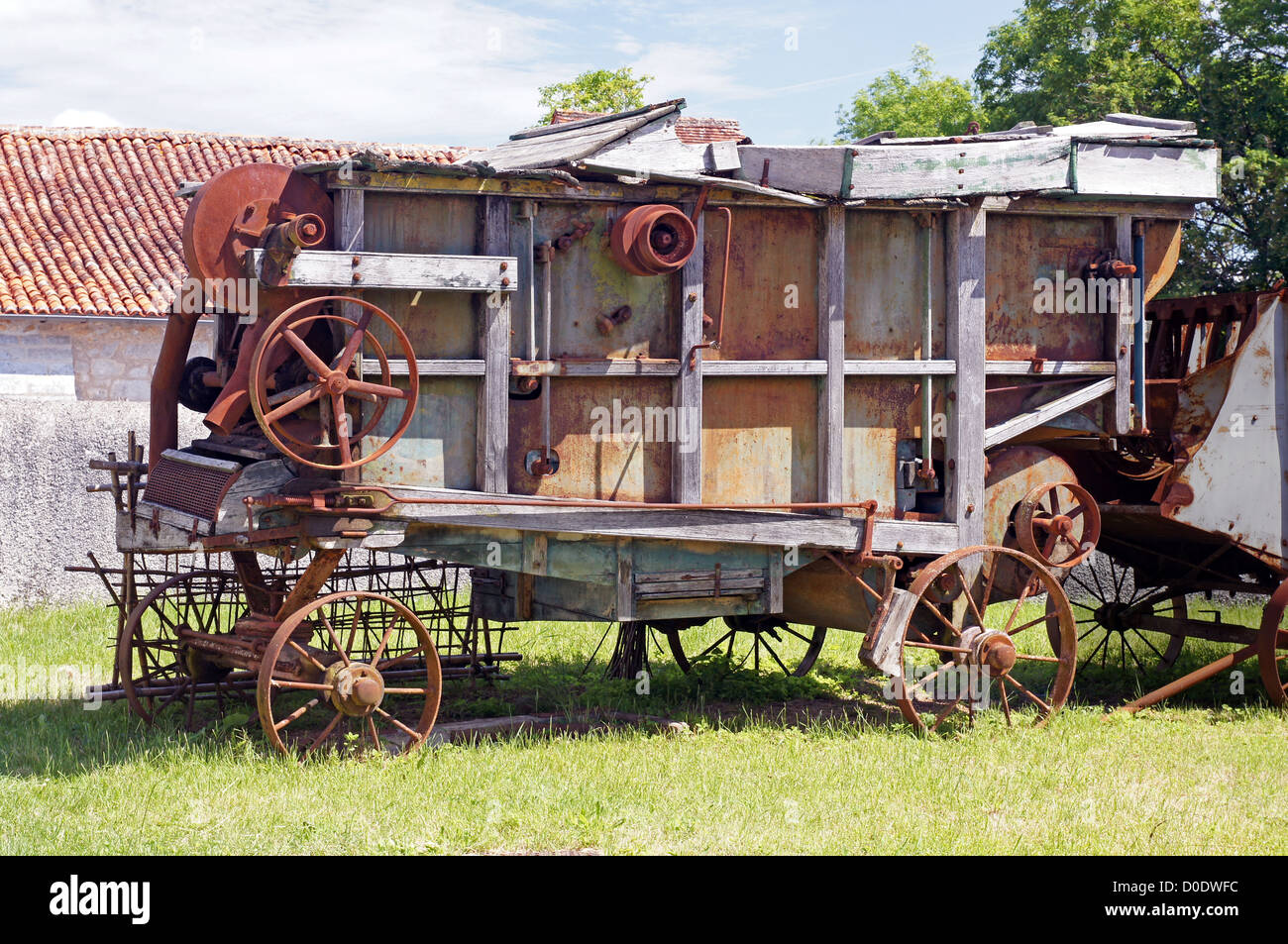 An old threshing machine Stock Photo - Alamy