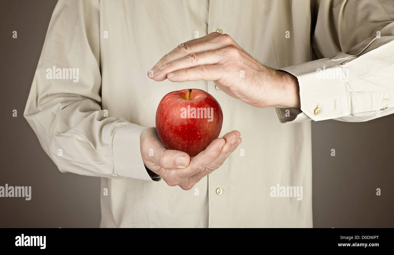 human hands protecting apple Stock Photo - Alamy