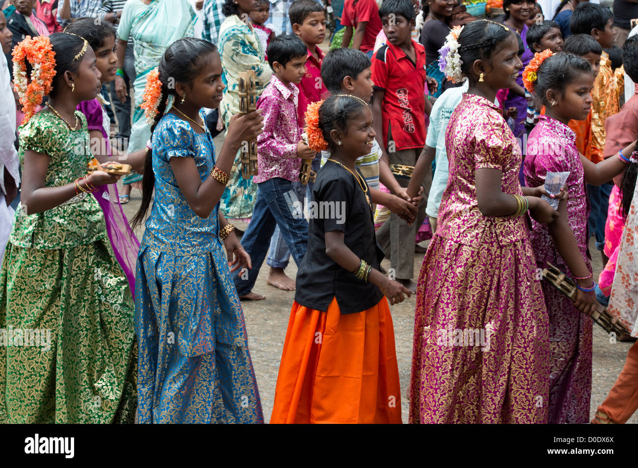 Young Indian girls with hand cymbals at a festival in the streets of ...