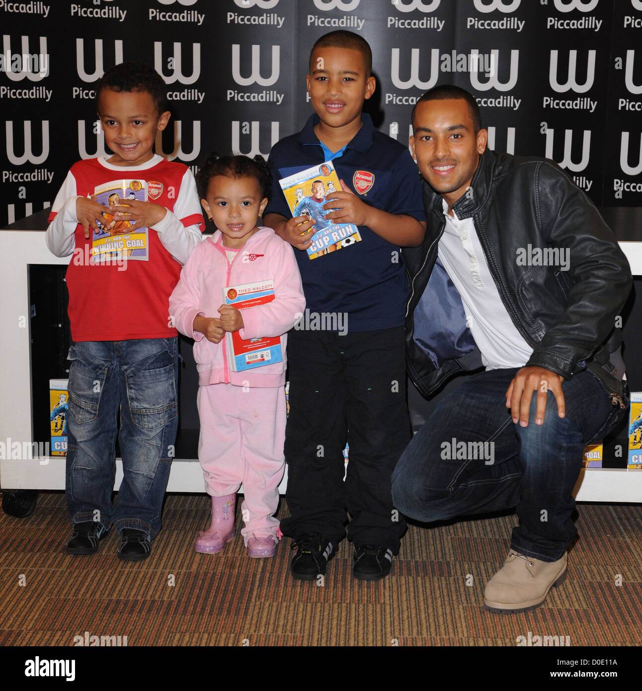 Signing theo walcott hi-res stock photography and images - Alamy