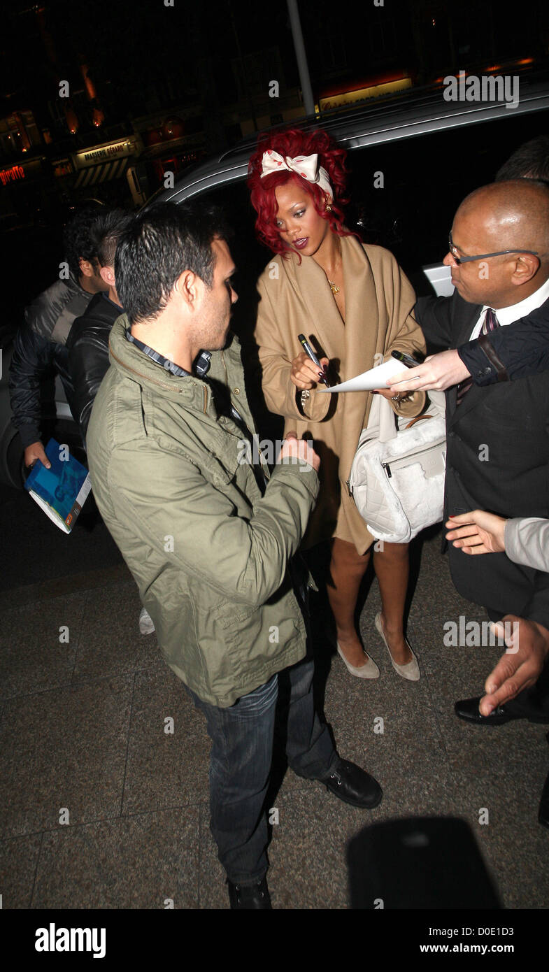 Rihanna is surrounded by fans as she arrives back at her hotel after ...