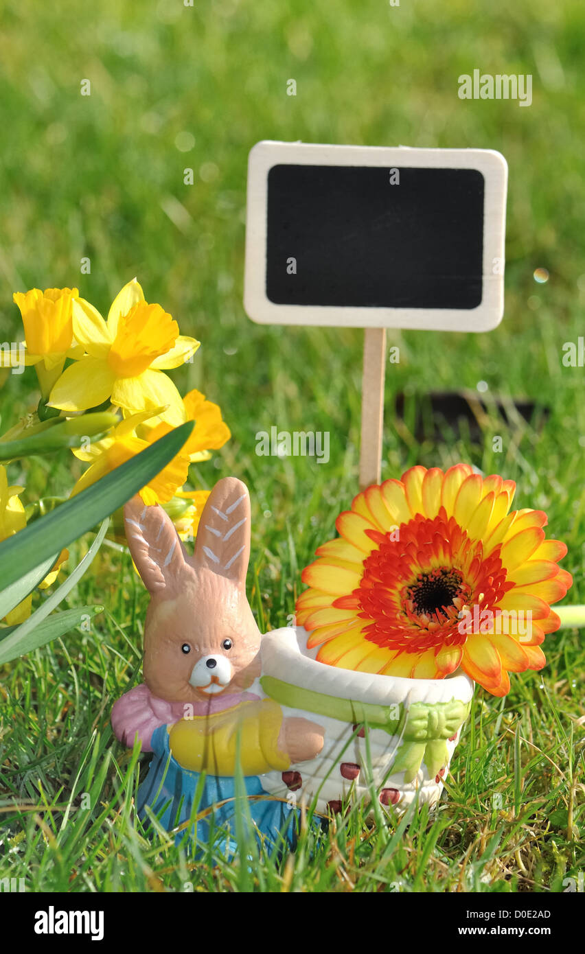 Figurine among flowers hi-res stock photography and images - Alamy