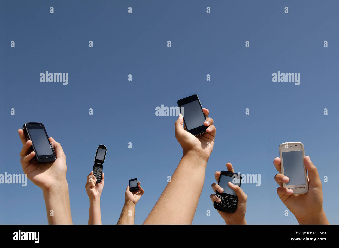 Group of hands with different cellphones connecting Stock Photo - Alamy