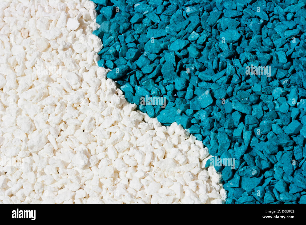 A closeup of colorful white and blue stones sand Stock Photo - Alamy