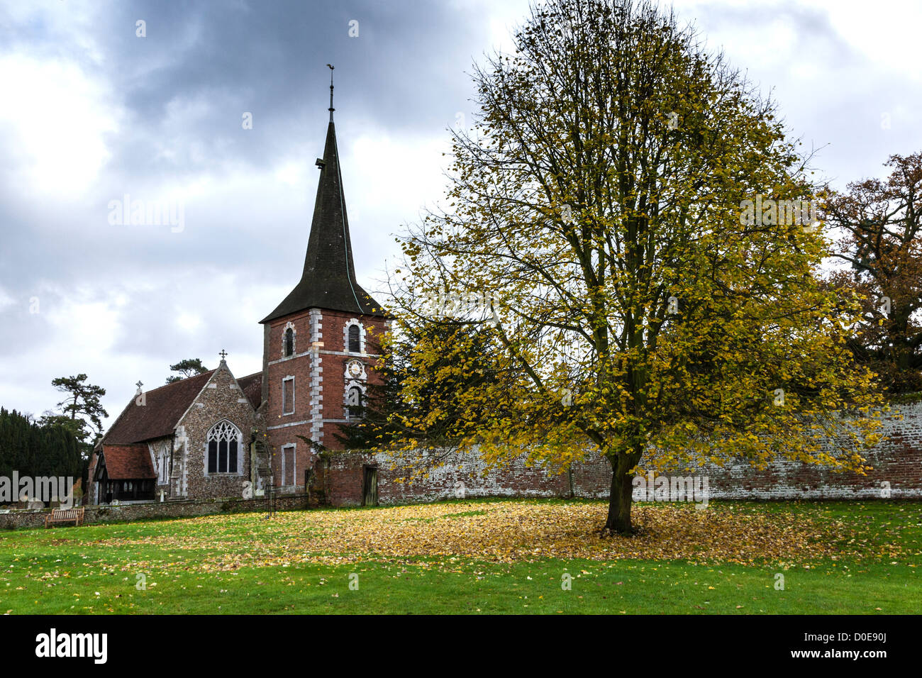 Tree in Autumn Leaf in Front of Village Church on Dull Day Stock Photo ...