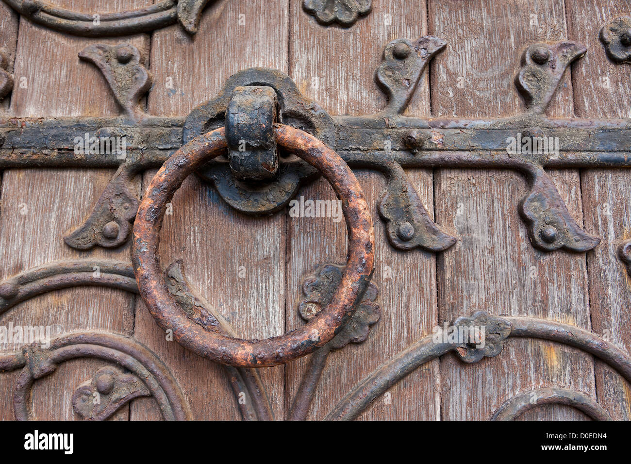 Old metal rapper with ironwork on old wooden door Stock Photo - Alamy