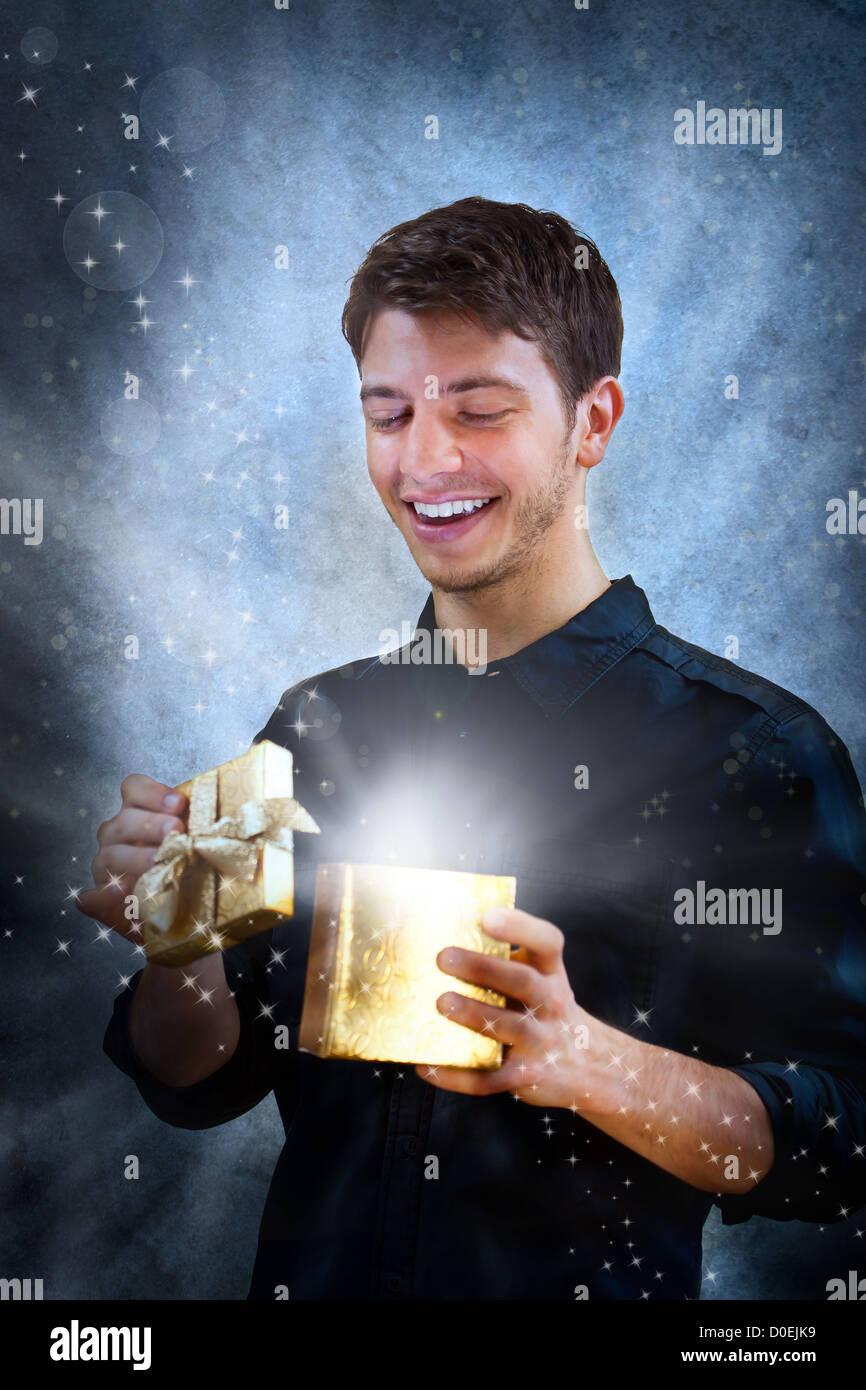 Man Opening a Magic Gift Box Stock Photo - Alamy