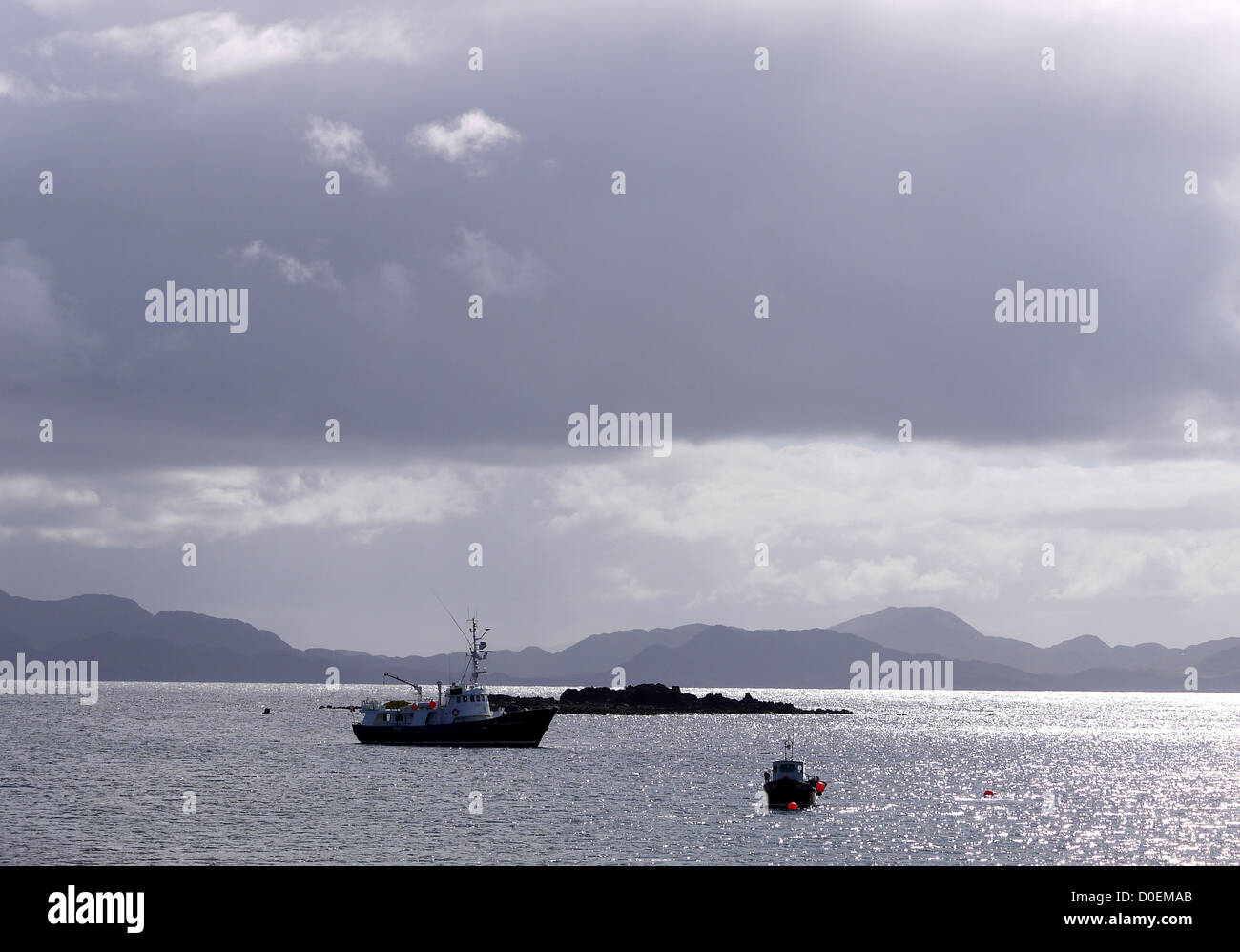 Fishing boat moored off the Isle of Muck Scotland Stock Photo - Alamy