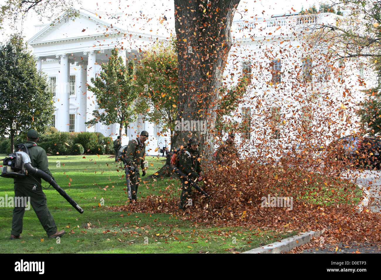 National Park Service Rangers leaf blowing on the rth Lawn of The White ...