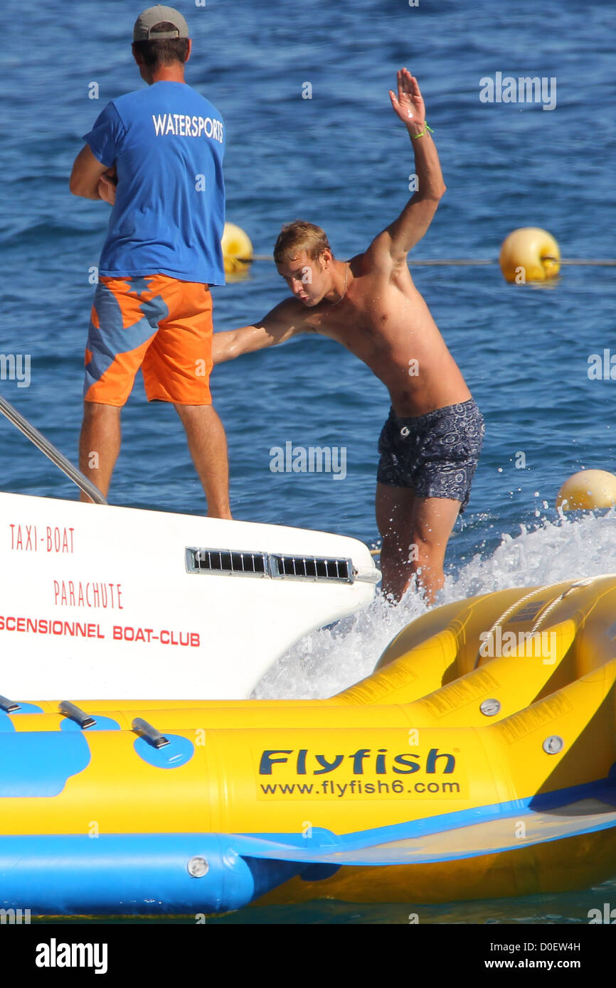 Pierre Casiraghi surfing with friends at the Monte-Carlo Beach club ...