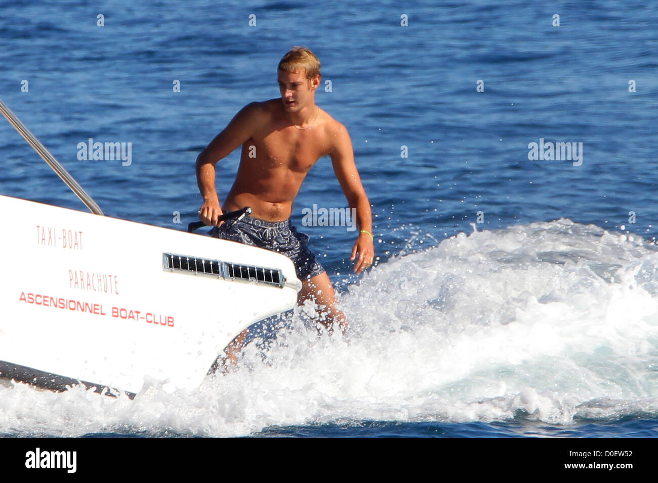Pierre Casiraghi surfing with friends at the Monte-Carlo Beach club ...