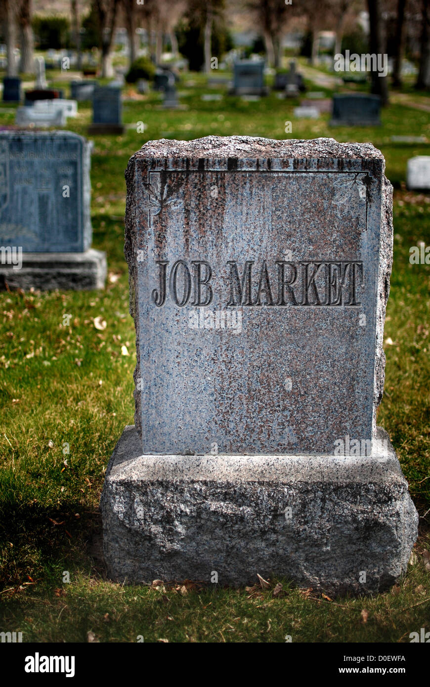 Gravestone in cemetery for job market and employment Stock Photo - Alamy