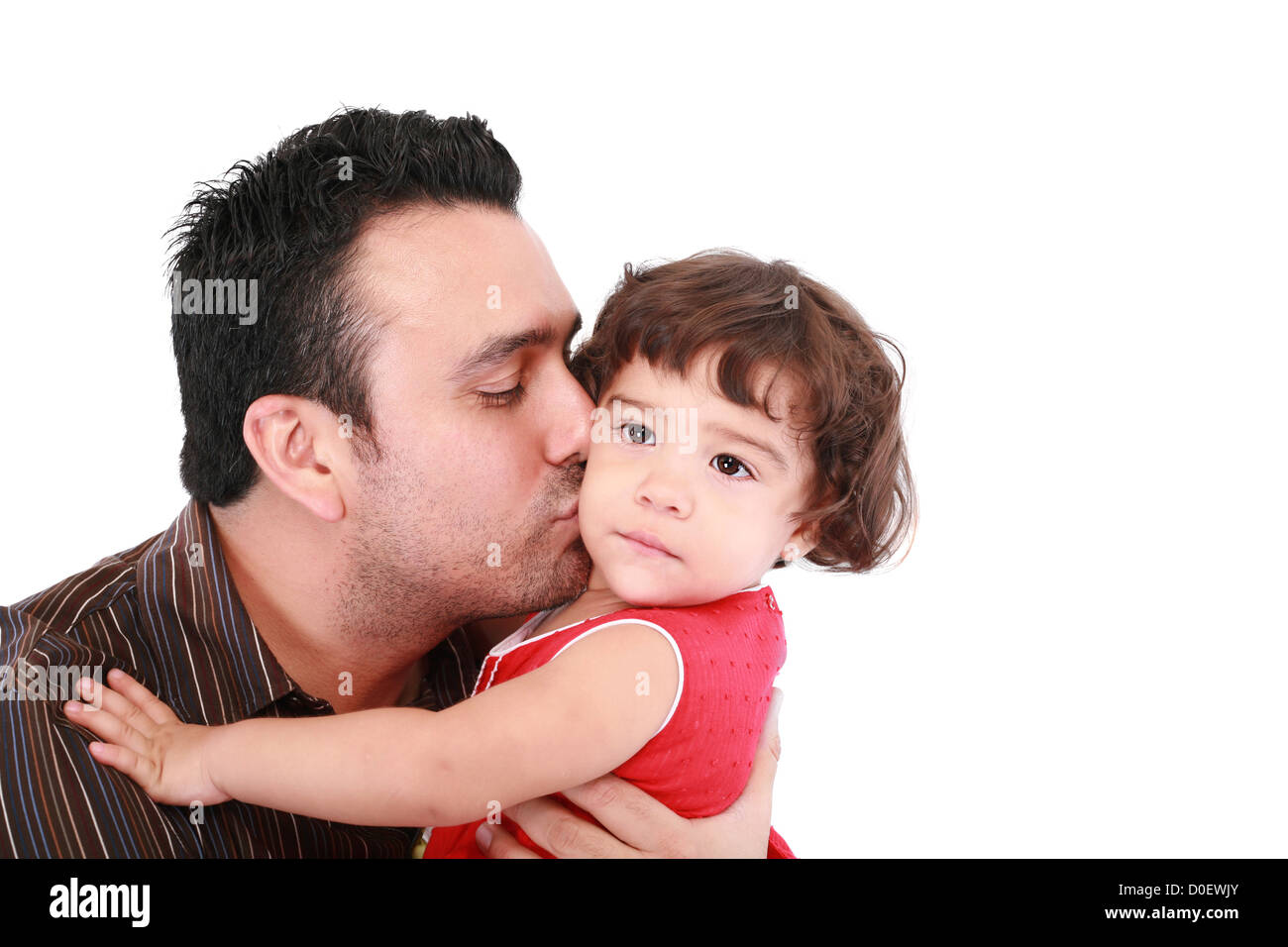 Father hugging and kissing little daughter, smiling Stock Photo - Alamy
