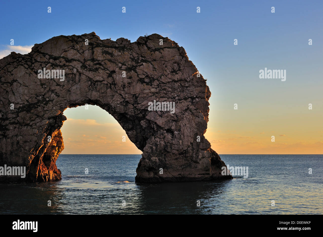 Durdle Door, a natural limestone arch at sunset along the Jurassic ...