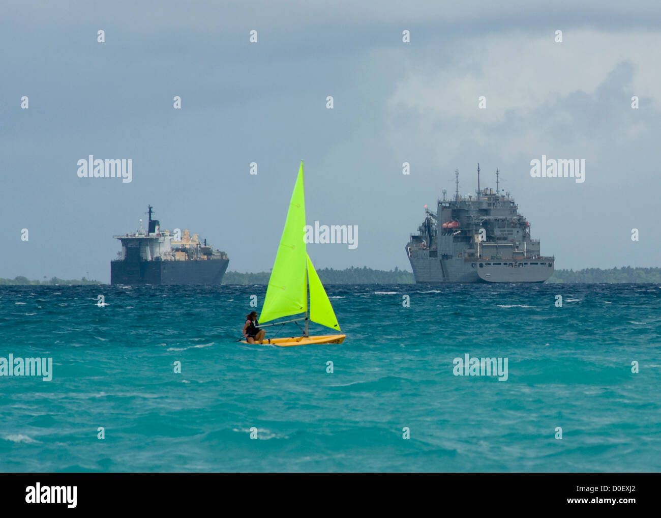 A US Sailor sails on a Pico sailboat November 4, 2012 In Diego Garcia ...