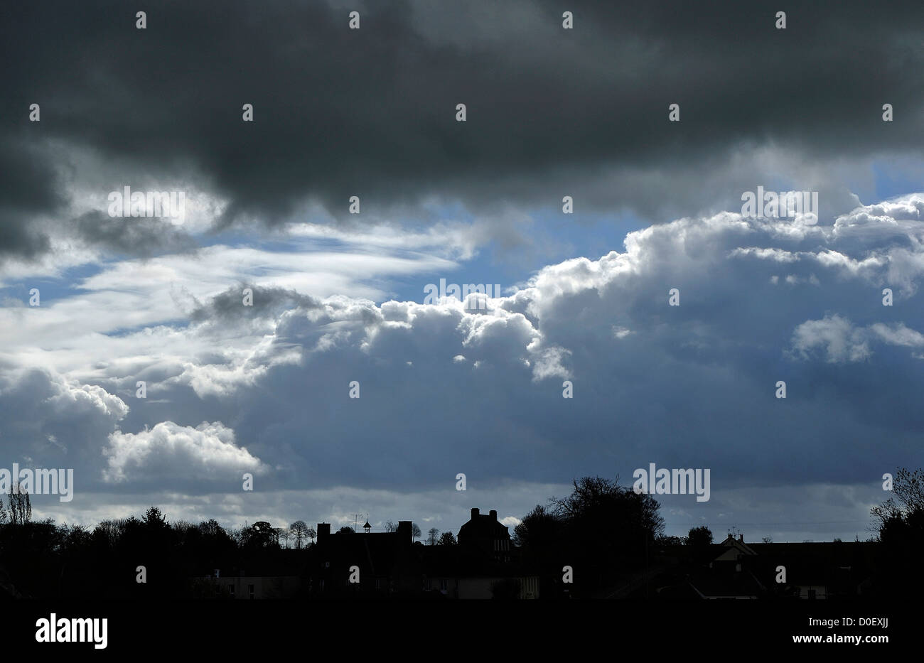 Dark heavy sky and rainy (stratocumulus), in may, above a village in ...